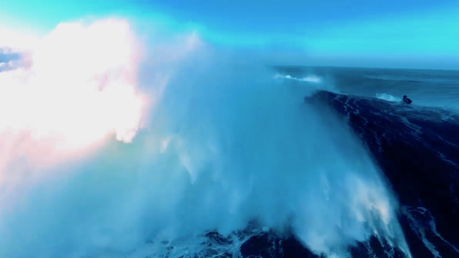 Drone video of surfer riding giant wave in Nazaré, Portugal