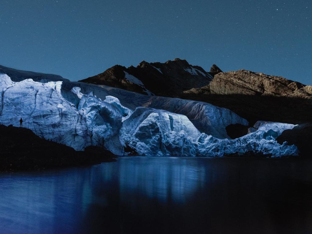 Glaciers dramatically lit up at night by a drone