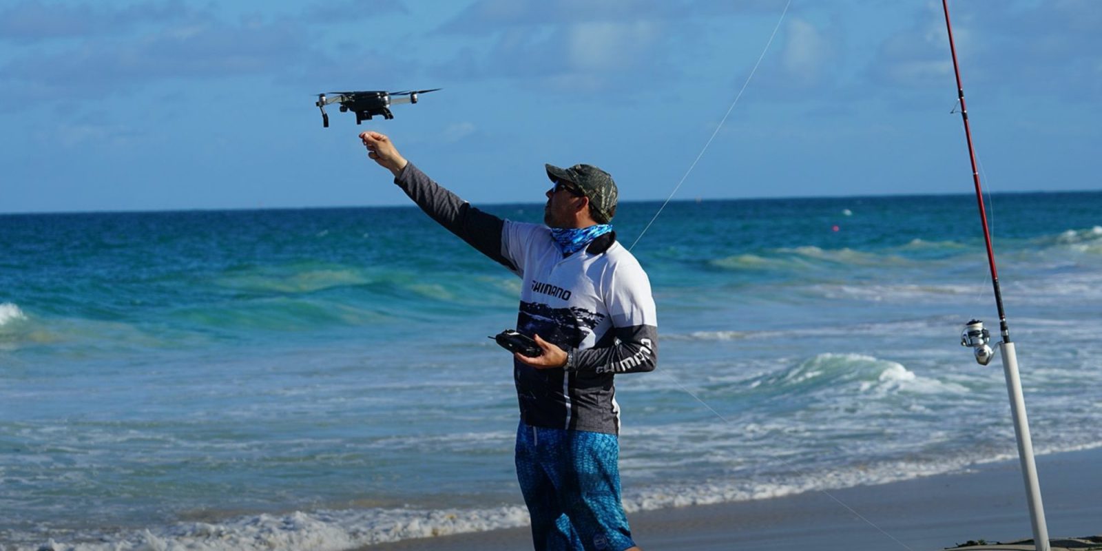 Modern fisherman has a rod, reel, and a DJI drone
